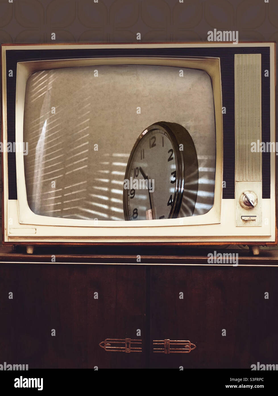 The clock shown on the screen of the old T. V Stock Photo - Alamy