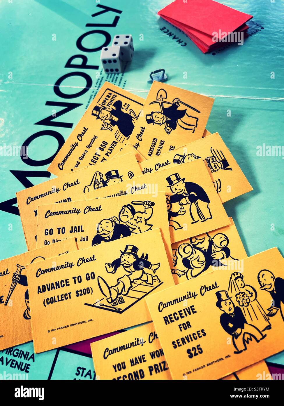 community-chest-cards-spread-on-a-monopoly-board-game-usa-stock-photo
