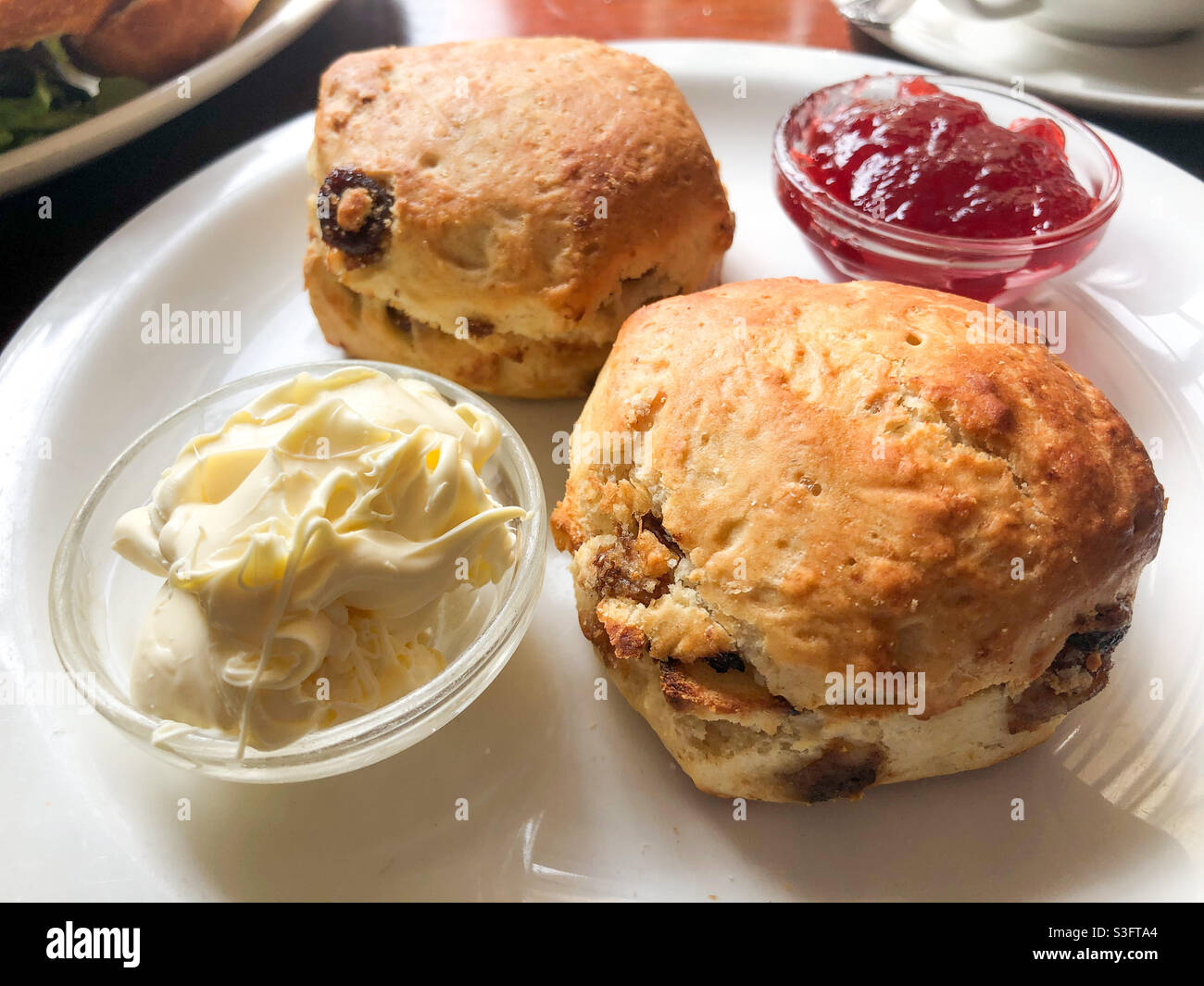 Cream tea with scones, jam and clotted cream Stock Photo - Alamy