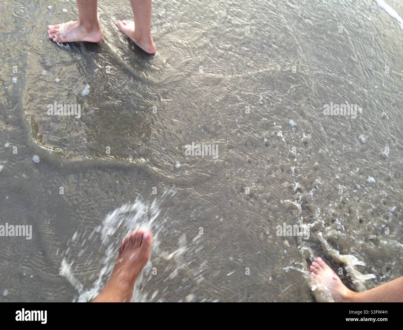 Splashing footprints hi-res stock photography and images - Alamy