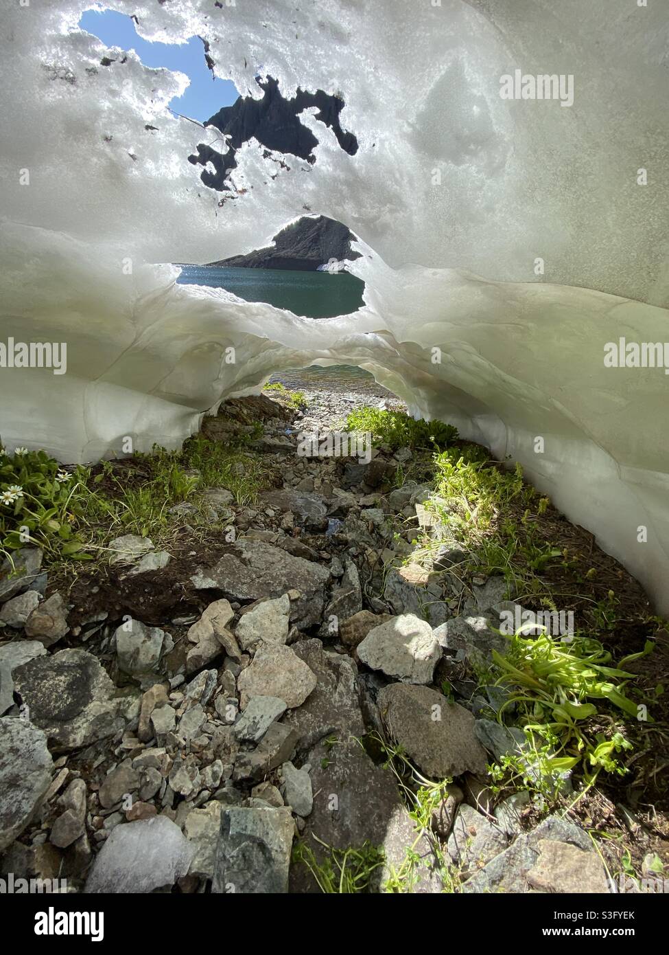 Natural snow melt creating a dome in the mountains Stock Photo - Alamy
