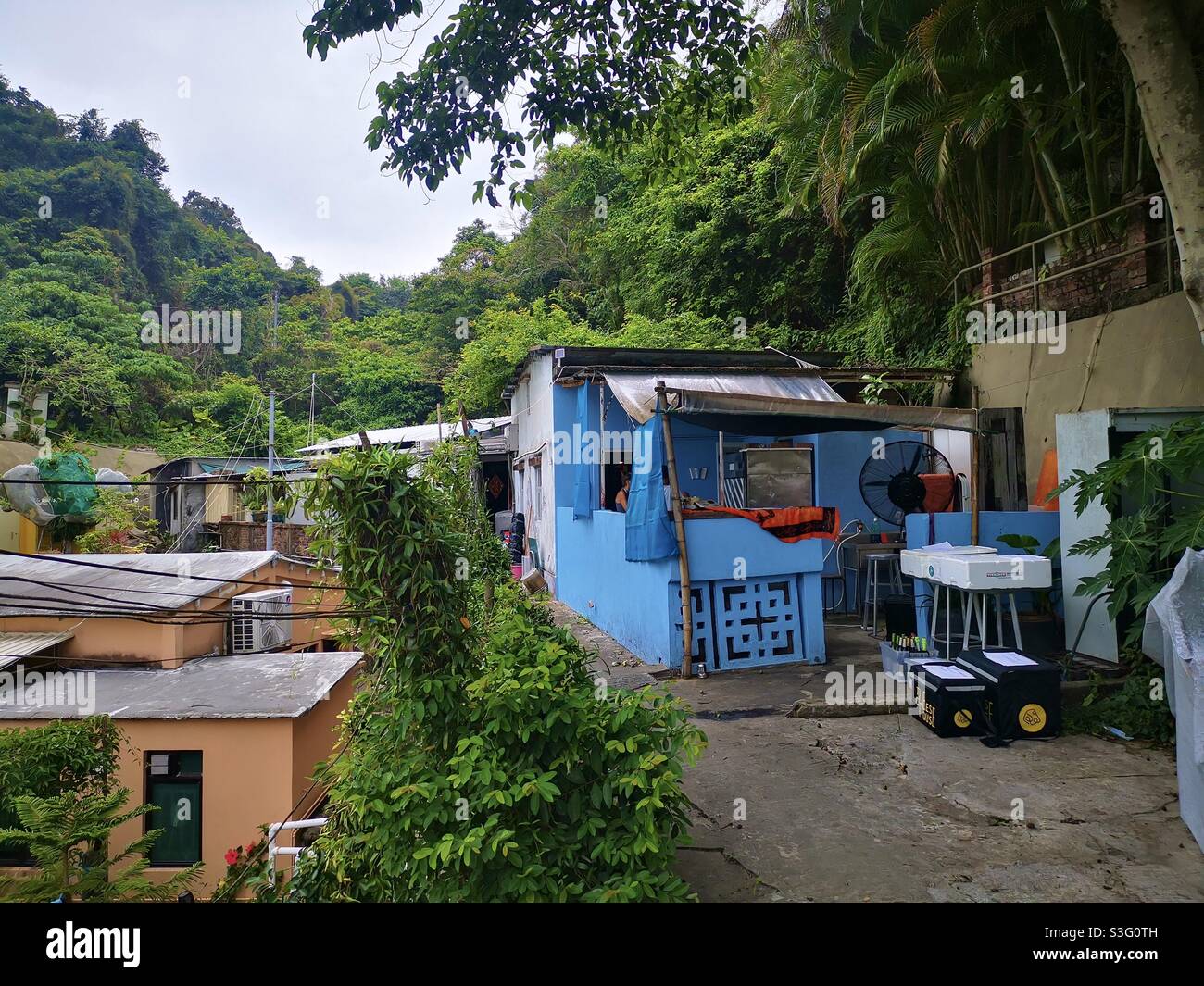 A beautiful blue house in a village on Lamma island in Hong Kong Stock ...