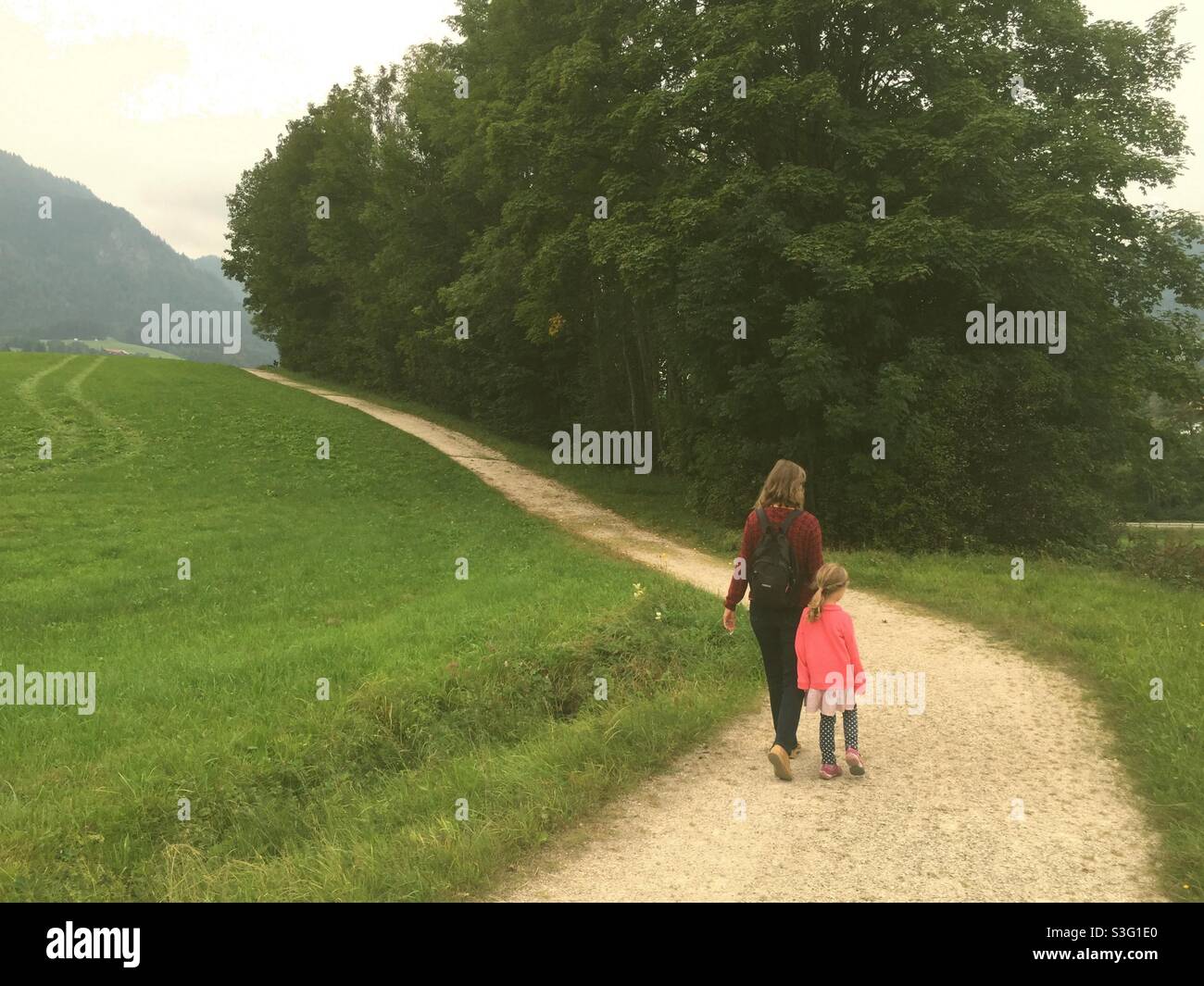 Mother and child walking a trail in the Bavarian Alps in Germany Stock ...