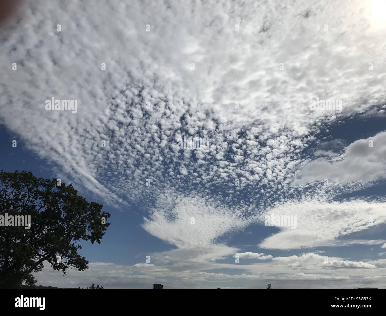 A burst of spraying cloud, which filled the skies against the blue ...