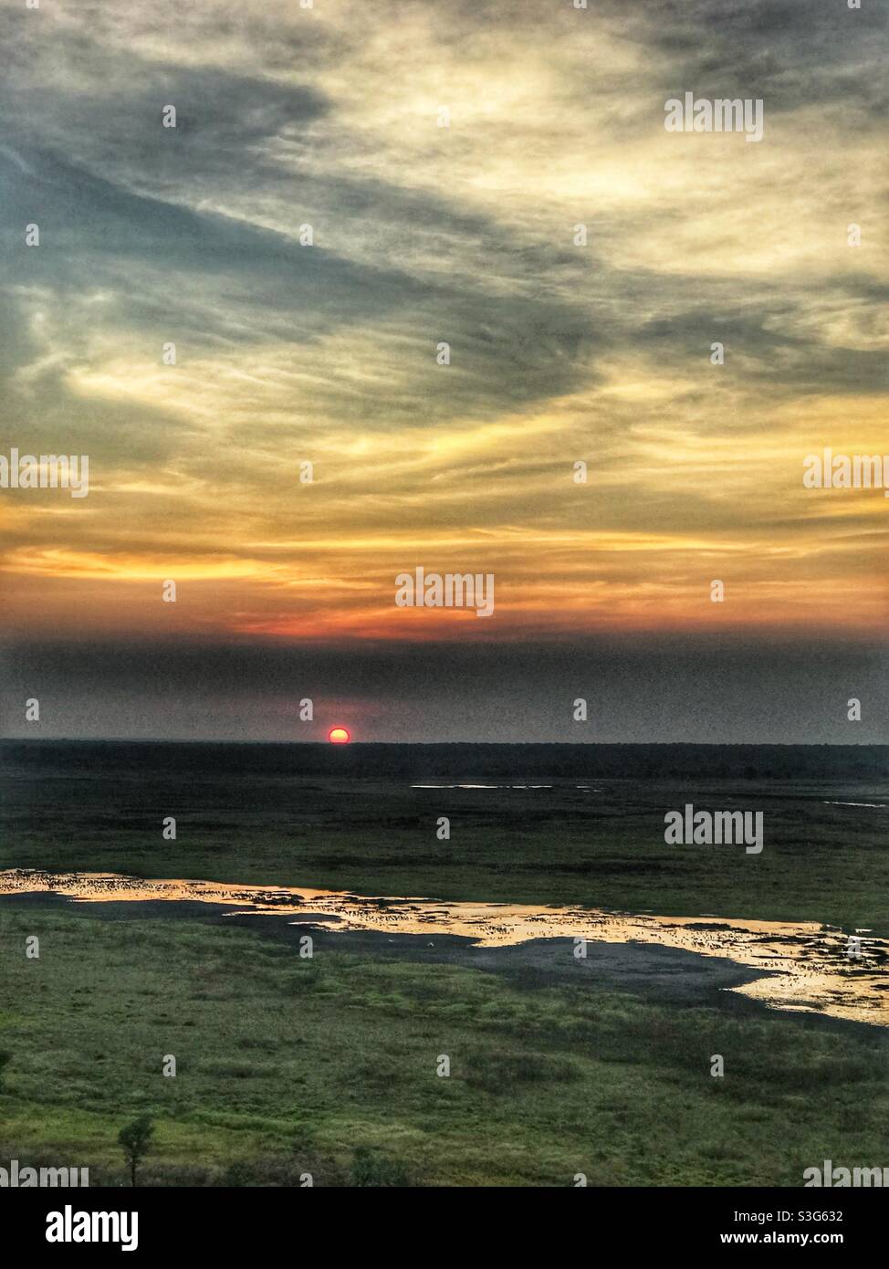 Sunset view over the Nadab floodplain from the Ubirr Rock lookout point in Kakadu National Park ...