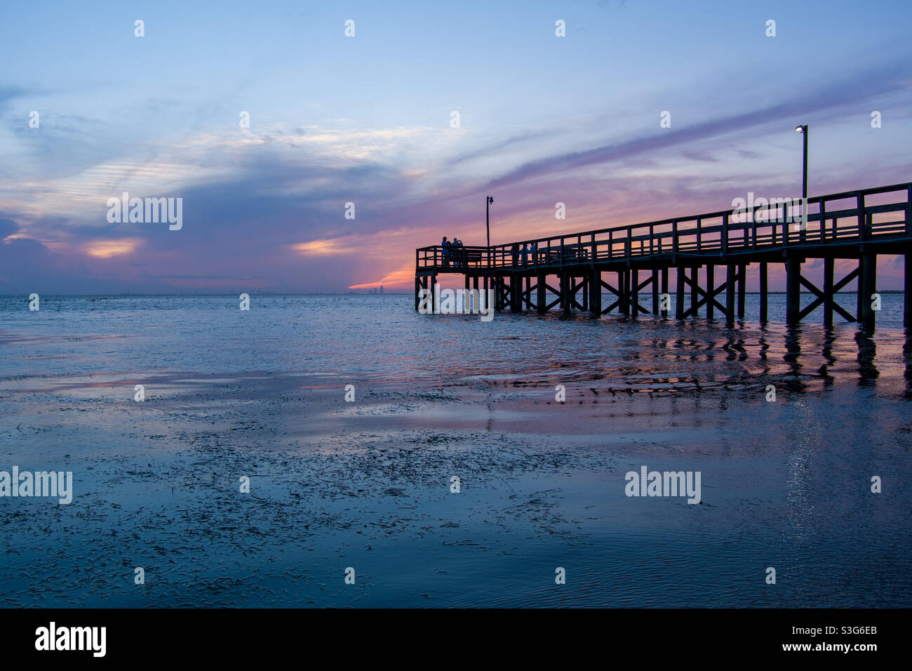 Sunset at the pier Stock Photo - Alamy