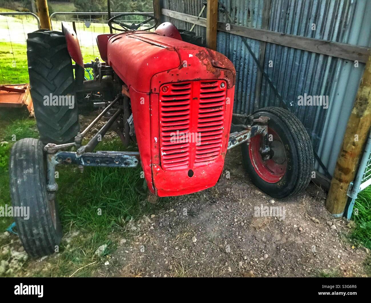 Red tractor on a farm in Tasmania, Australia Stock Photo - Alamy
