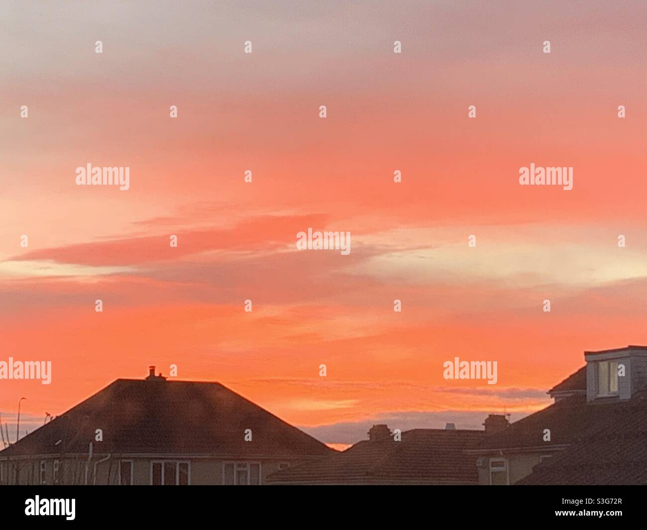 Sunset over roofs hi-res stock photography and images - Alamy