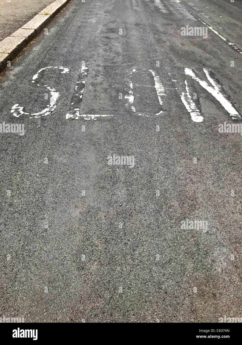 Road Marking Slow Sign Painted High Resolution Stock Photography and ...