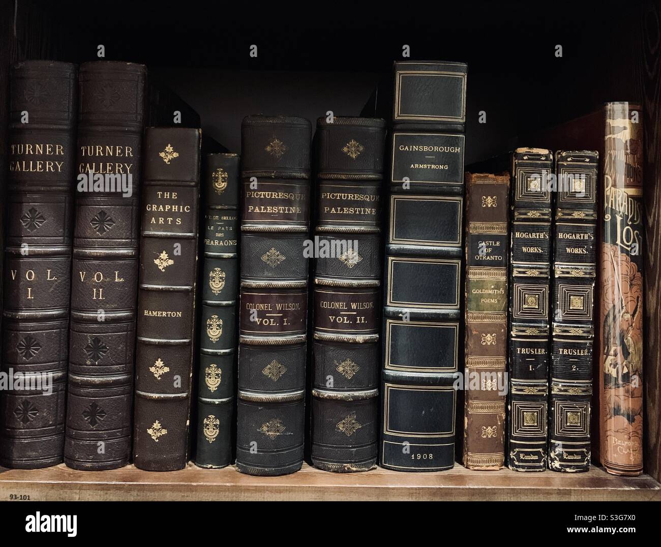 Old vintage books on bookshelf in library Stock Photo - Alamy