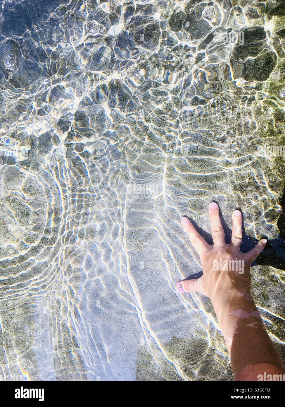 Child water hand hi-res stock photography and images - Alamy