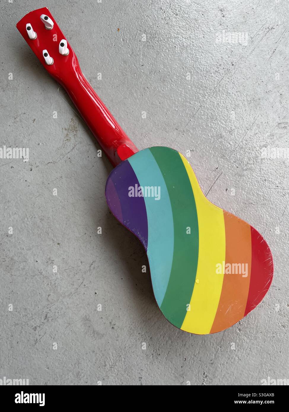 Rainbow colored guitar Stock Photo - Alamy