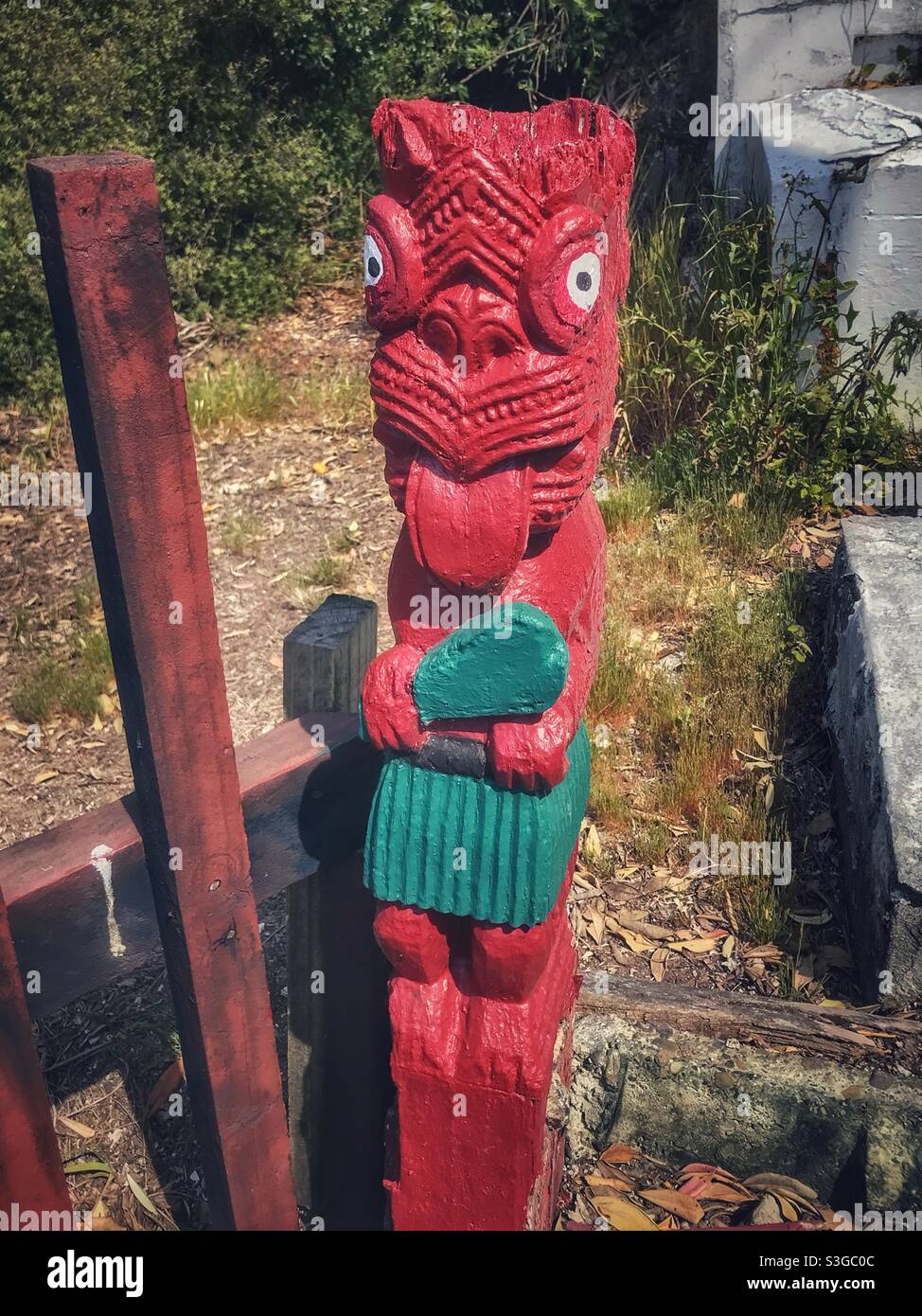 Tiki carved fence post, Rotorua, North Island, New Zealand Stock Photo ...