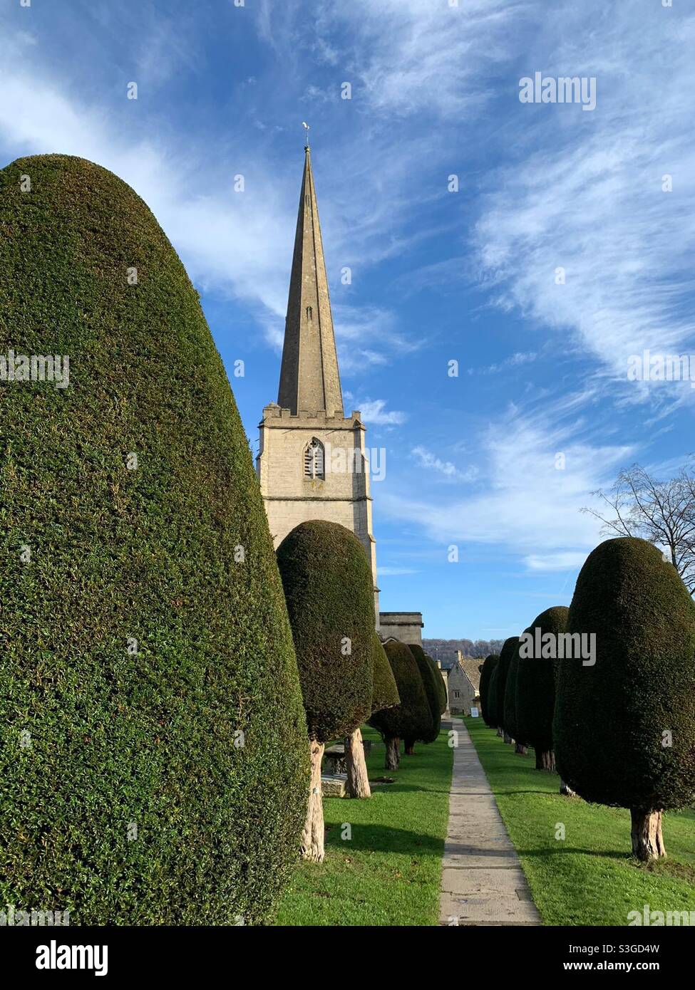 Round shrub surrounding church in Painswick, England, United Kingdom ...
