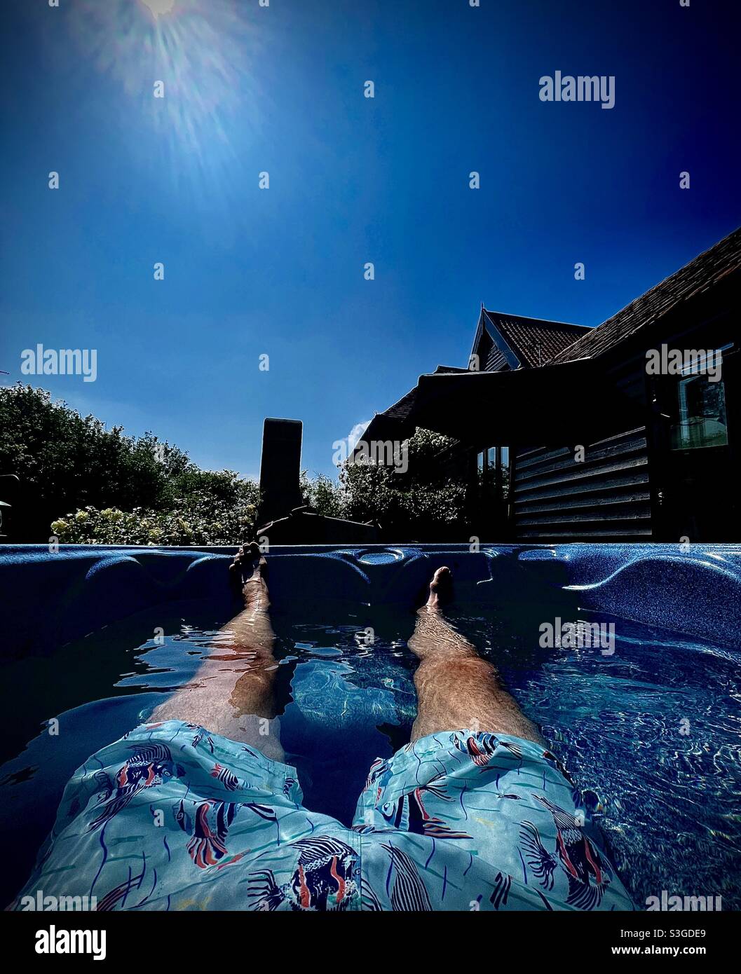 Sunbathing in shorts hi-res stock photography and images - Alamy