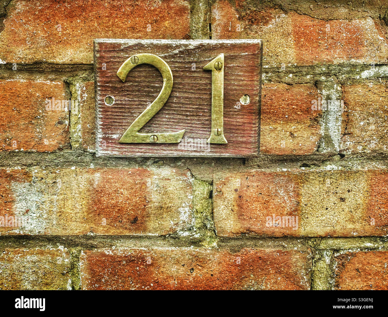 The number 21 on a brick wall Stock Photo - Alamy