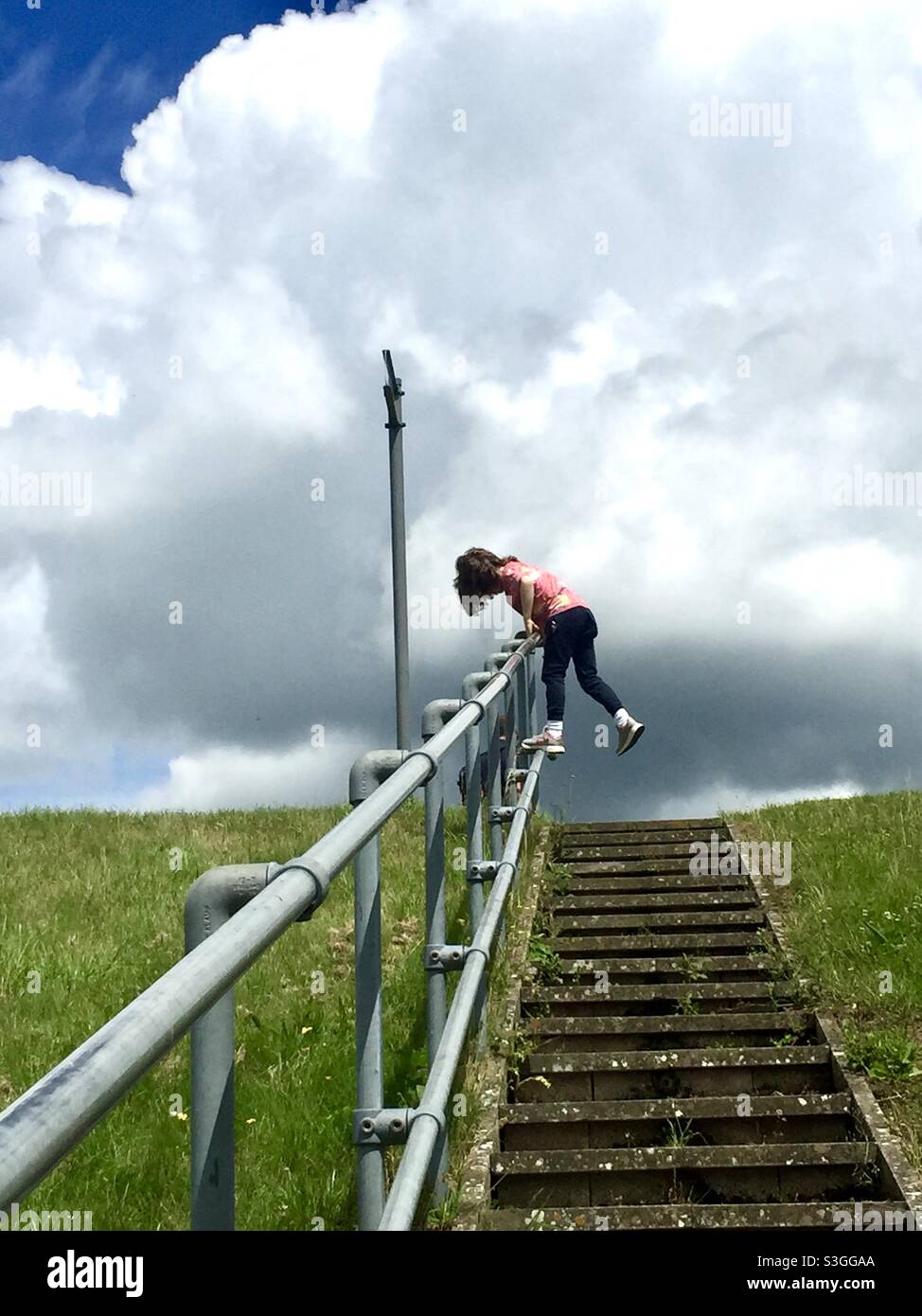 Boy climbing stairs hi-res stock photography and images - Alamy