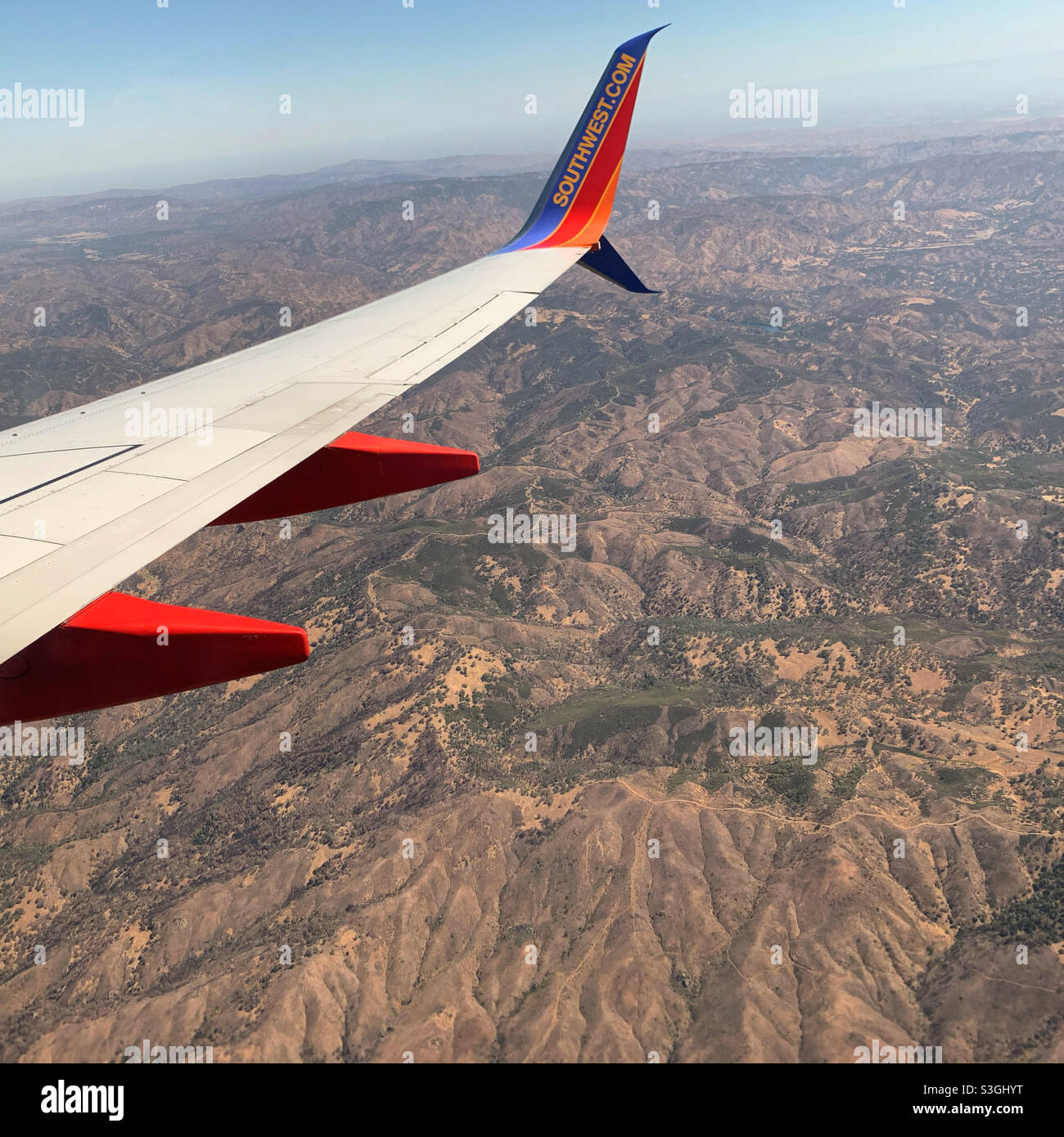 The wing of a Southwest Airlines airplane during a flight over the ...