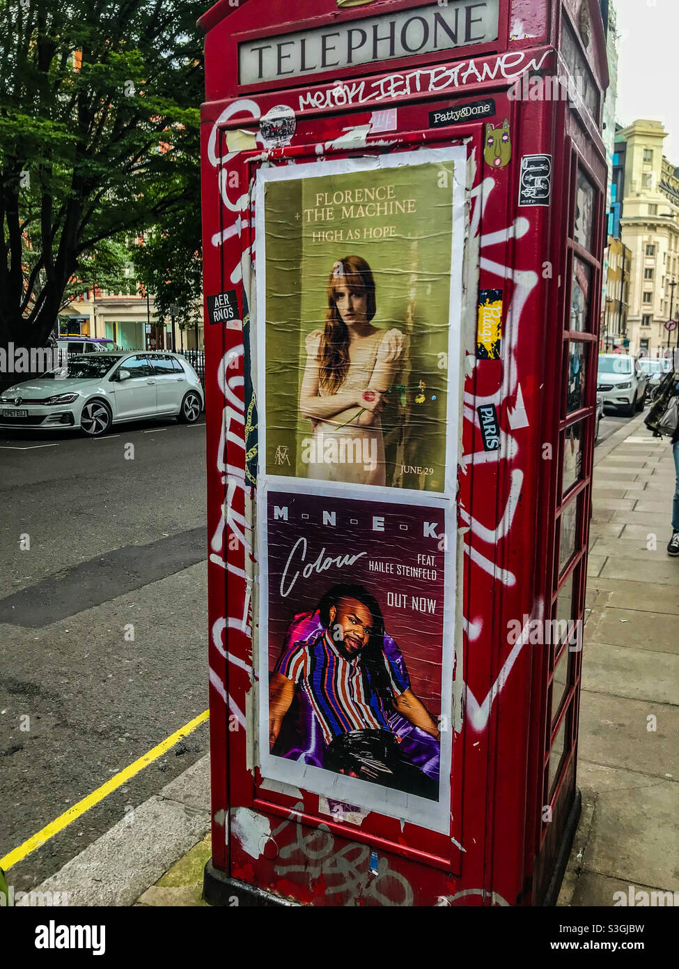 London telephone box with music posters Stock Photo - Alamy