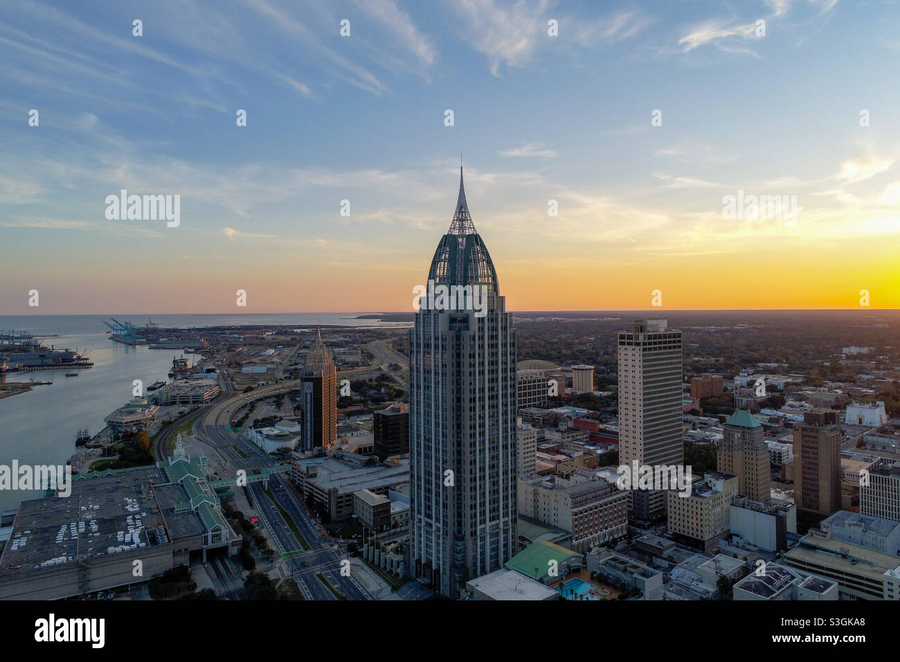 Downtown city skyline at sunset Stock Photo - Alamy