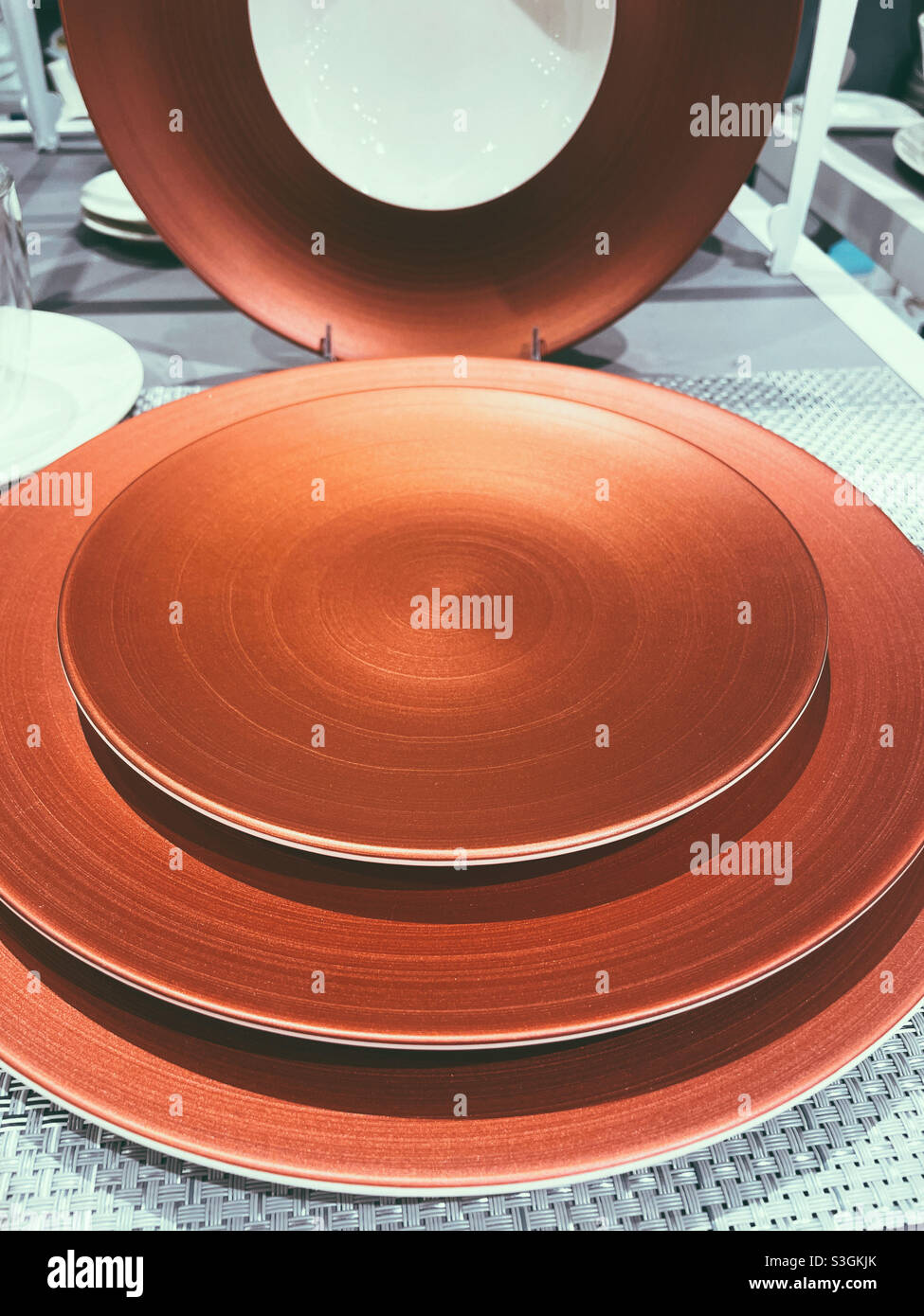 Porcelain plates on display for sale in an upscale retail store, USA ...