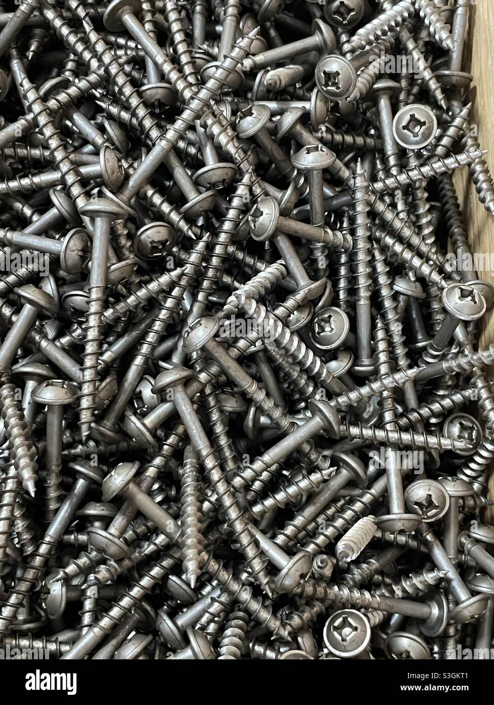Hardware puzzle. Screws in storage container Stock Photo - Alamy