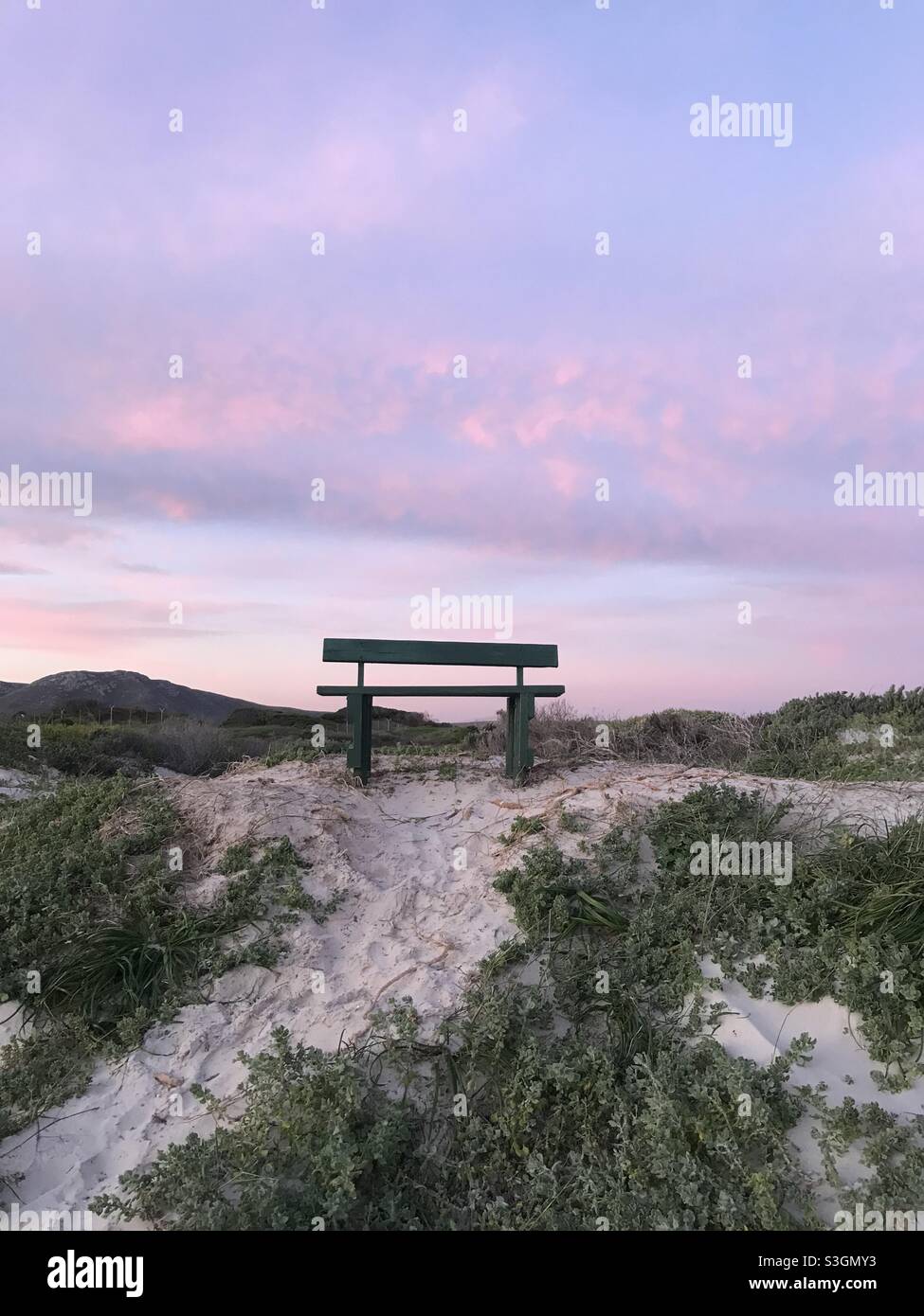 Beach bench sunset Stock Photo - Alamy