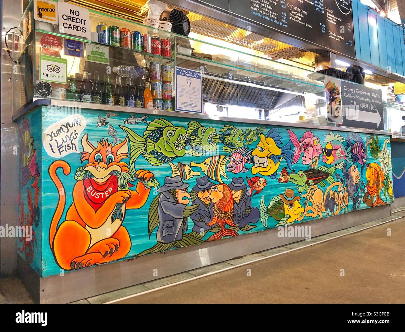 A colourful mural at a food stall at the indoor St Lawrence Market in ...
