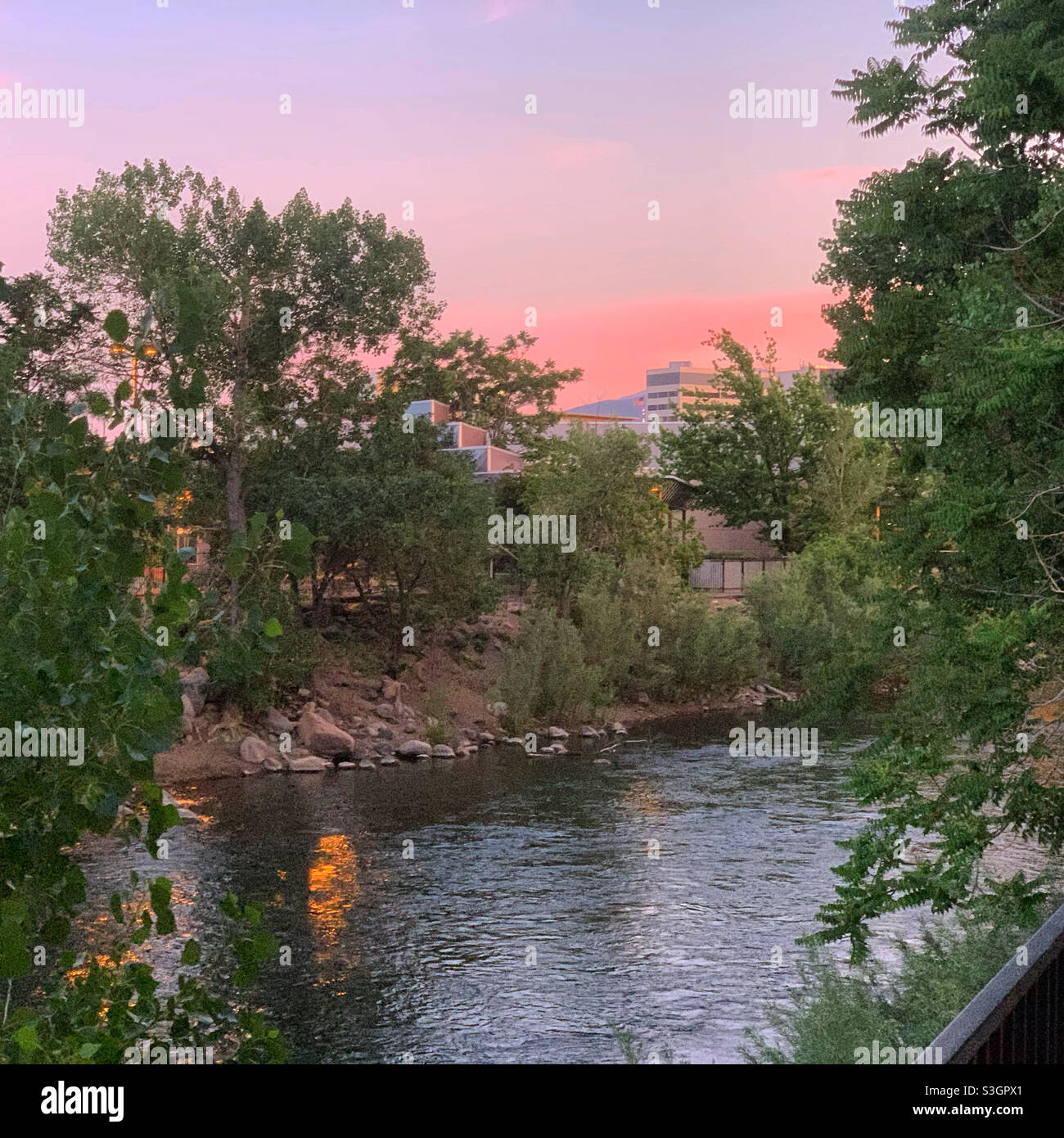 June, 2021, sunset view of the Truckee River from the deck behind the ...