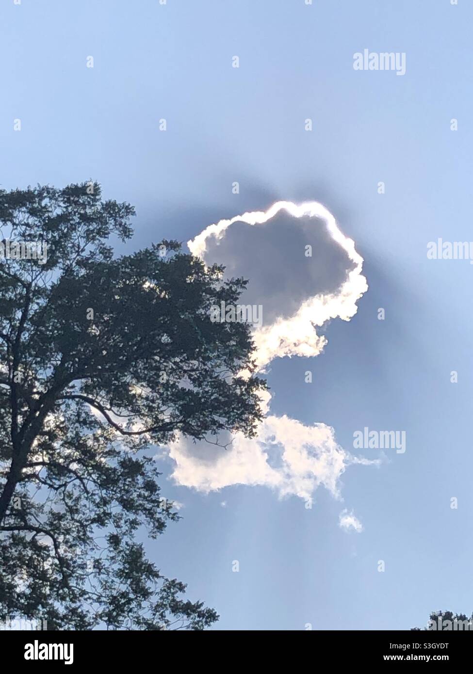 Sun behind a cloud hi-res stock photography and images - Alamy