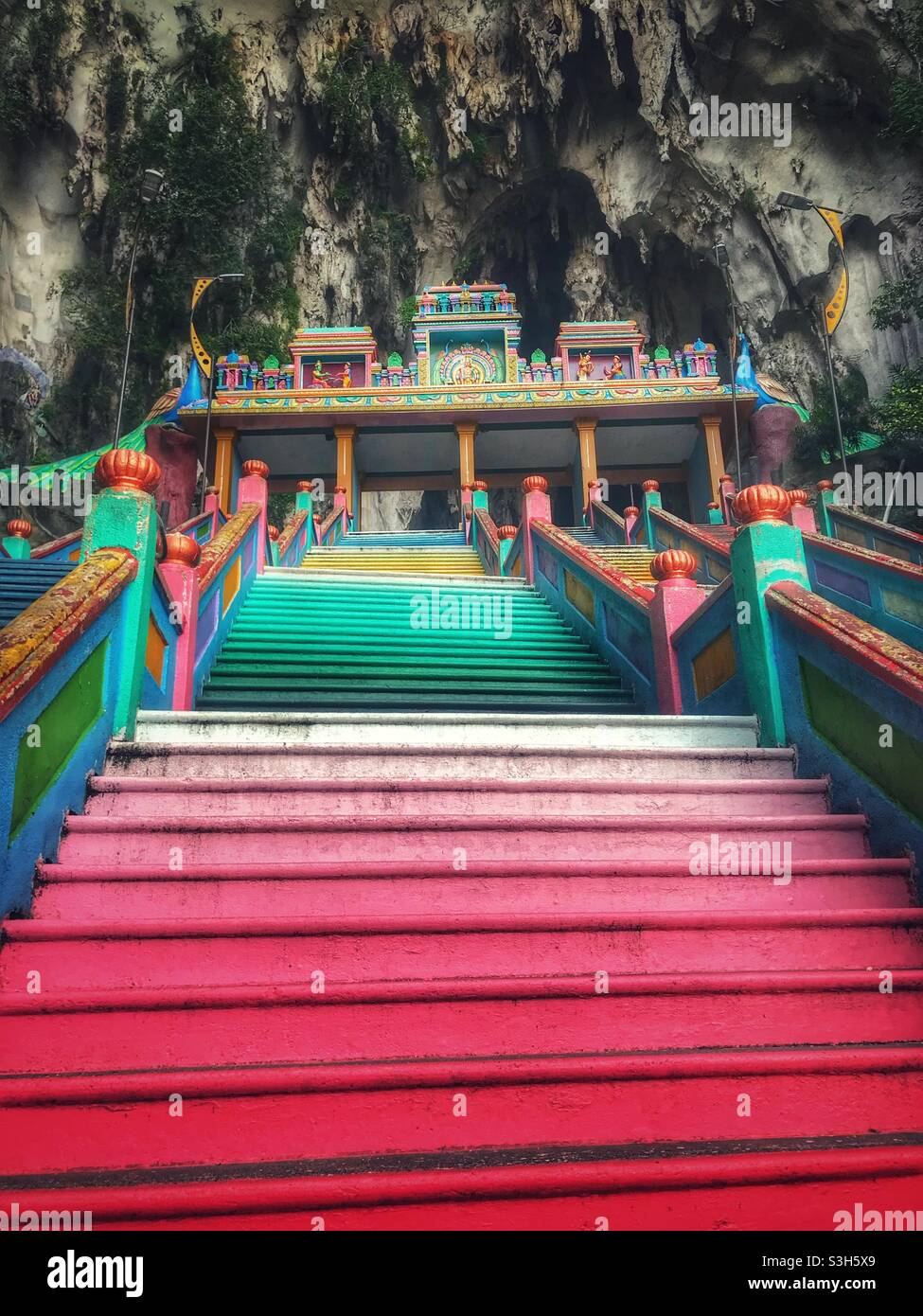 Colorful stairs leading to the Batu Caves temples in Kuala Lumpur ...