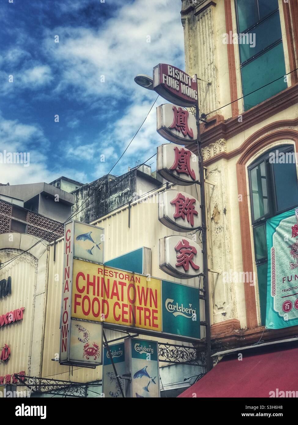 Exterior view of restaurant signs on a historic building In Chinatown ...