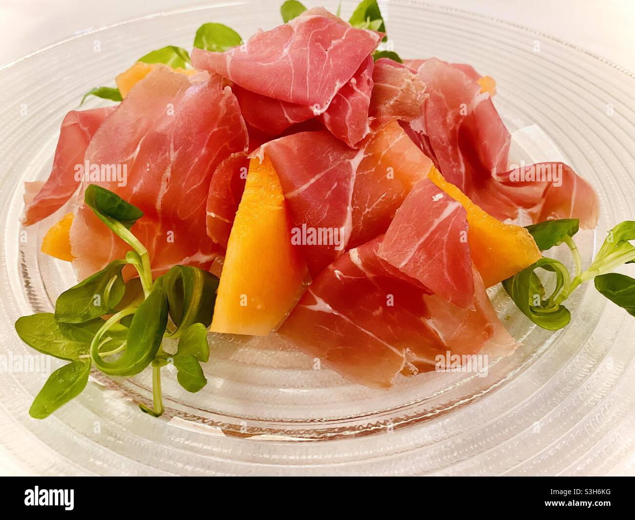 Fresh ham (prosciutto) and melon antipasto in Italy Stock Photo - Alamy