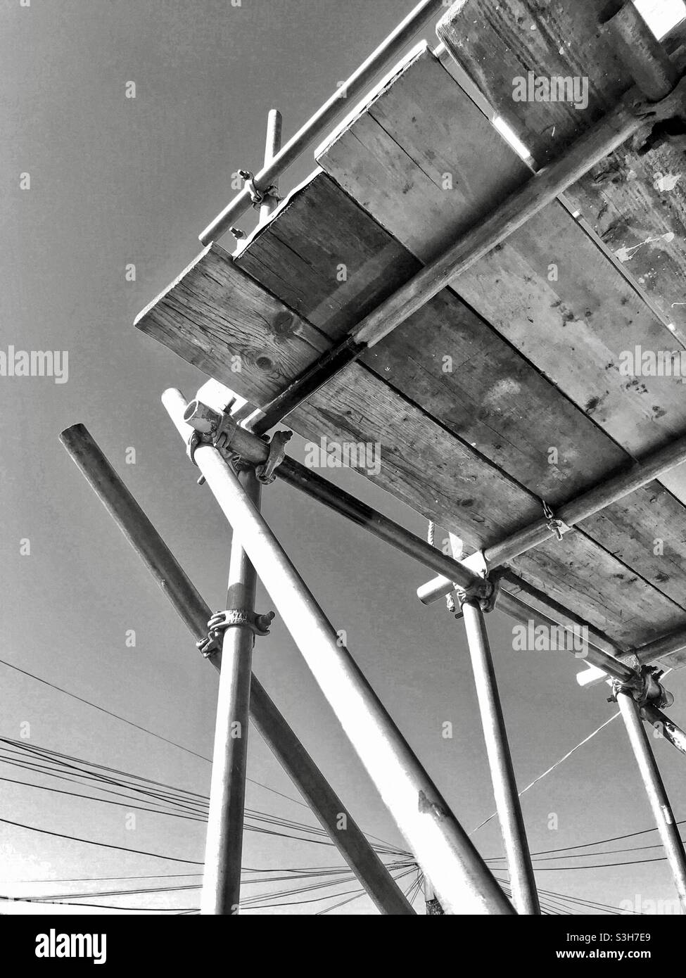 Building scaffolding seen against a clear sky Stock Photo - Alamy