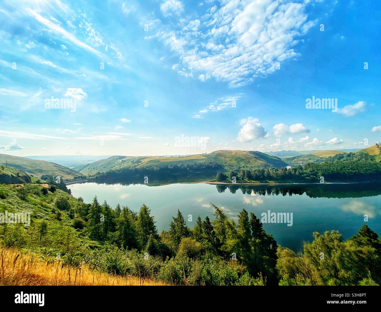A photograph of a beautiful reservoir with gorgeous sky and reflections ...