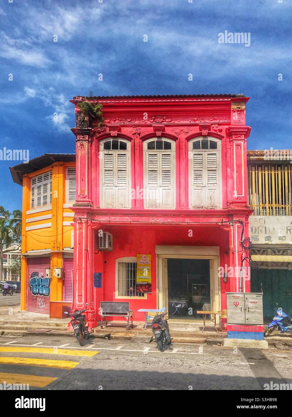 Brightly colored historic shophouse building s in George Town, Penang ...