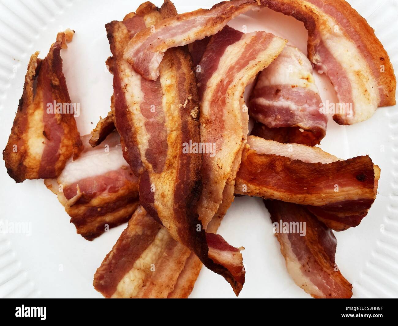 Fried streaky bacon Stock Photo - Alamy