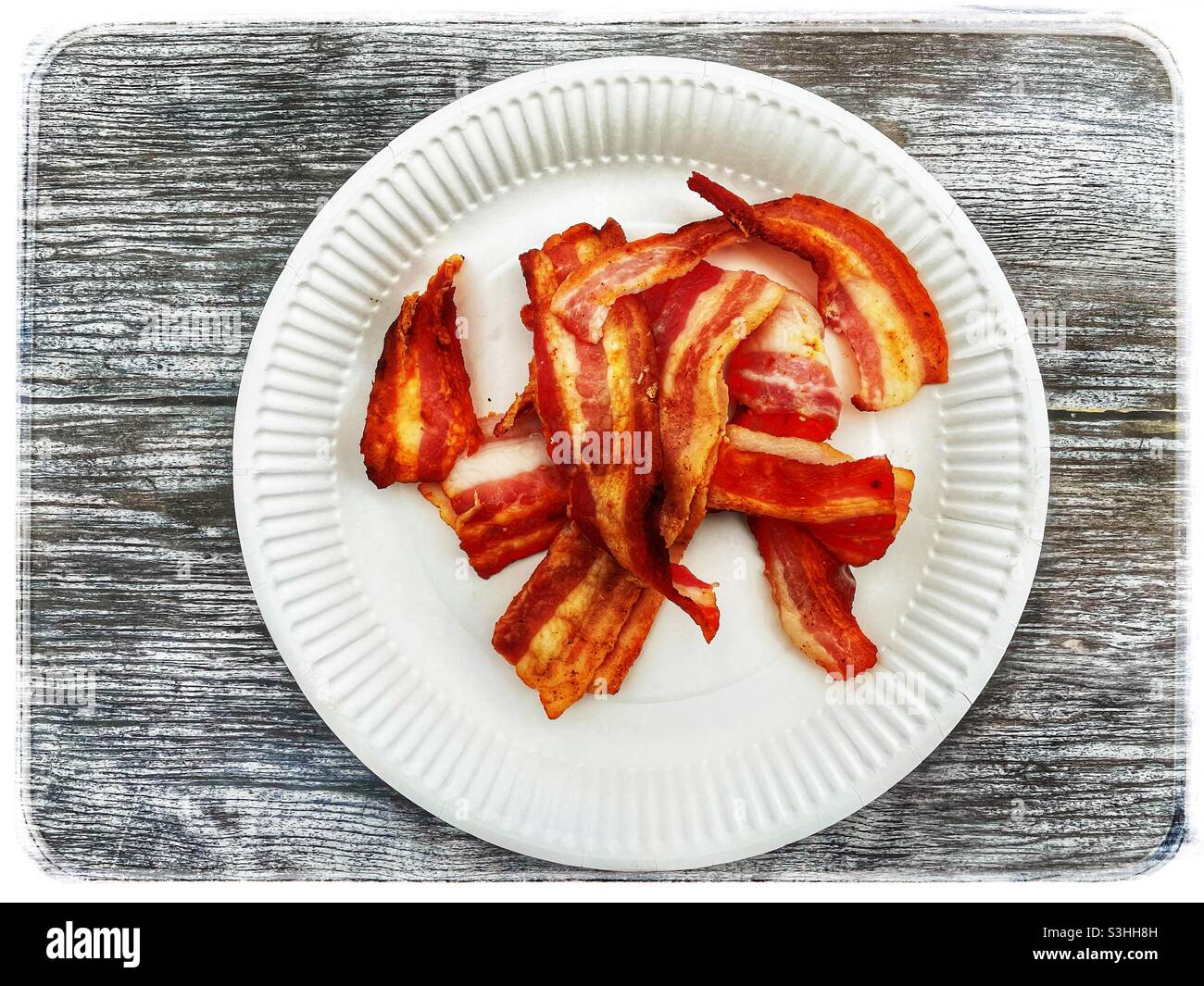 Fried streaky bacon Stock Photo - Alamy