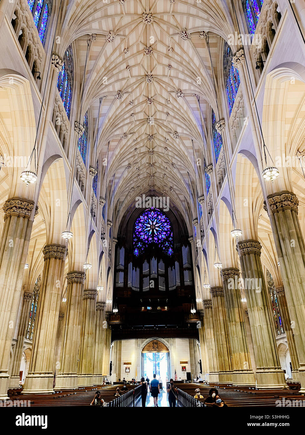 St. Patrick’s Cathedral features a huge stained glass window above its ...
