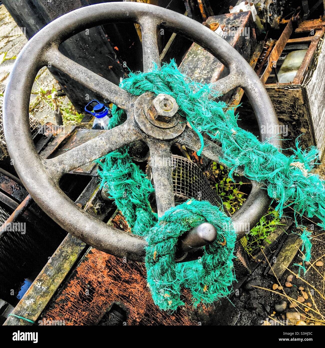 Old metal Winch wheel with rope attached Stock Photo - Alamy