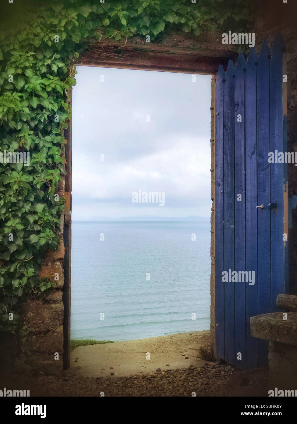An open door leading to the sea Stock Photo - Alamy