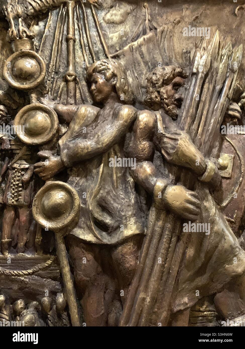 Scene from mural at Cardiff castle showing people carrying spears and ...