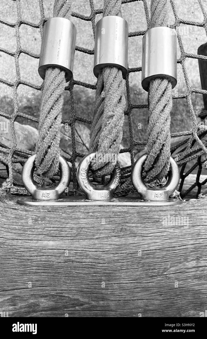 Three ropes with three eyelets Stock Photo - Alamy