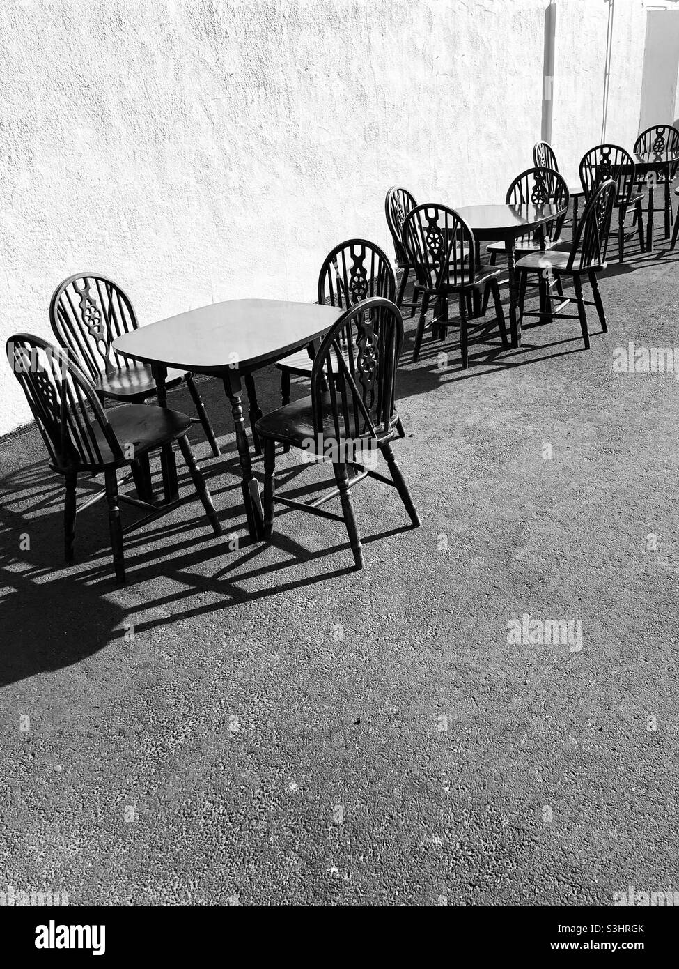 White chairs tables Black and White Stock Photos & Images - Alamy