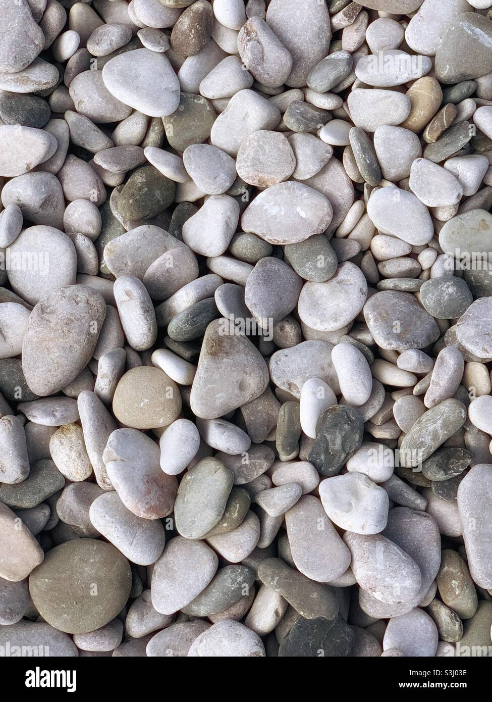 Grey pebbles hi-res stock photography and images - Alamy