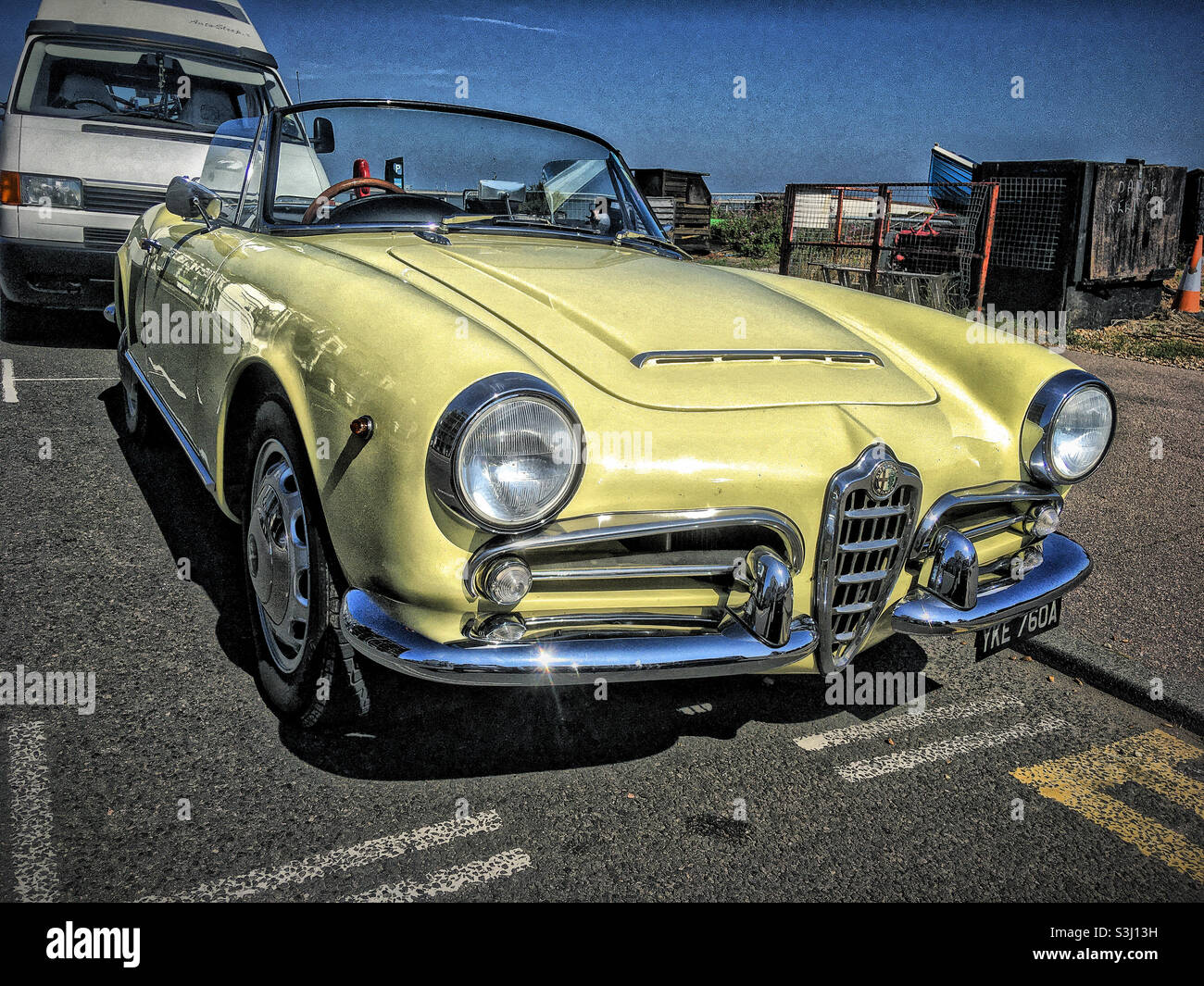 A Yellow, 1963 Alfa Romeo Giulia Spyder Roadster, parked on the ...