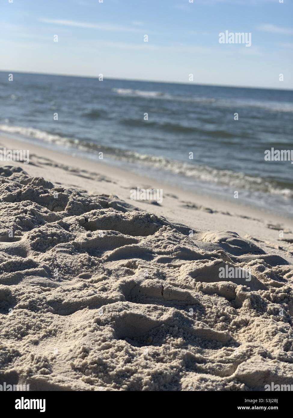 Where the sand meets the sea Stock Photo - Alamy