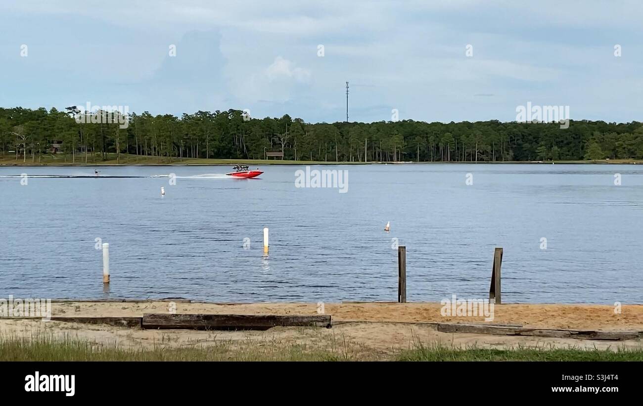Boat surfing on lake USA Stock Photo - Alamy