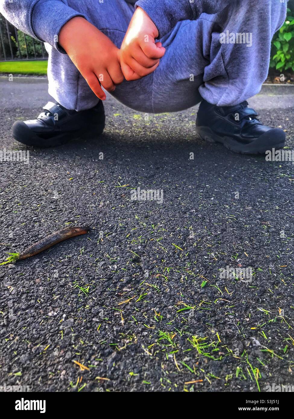 Boy crouches hi-res stock photography and images - Alamy