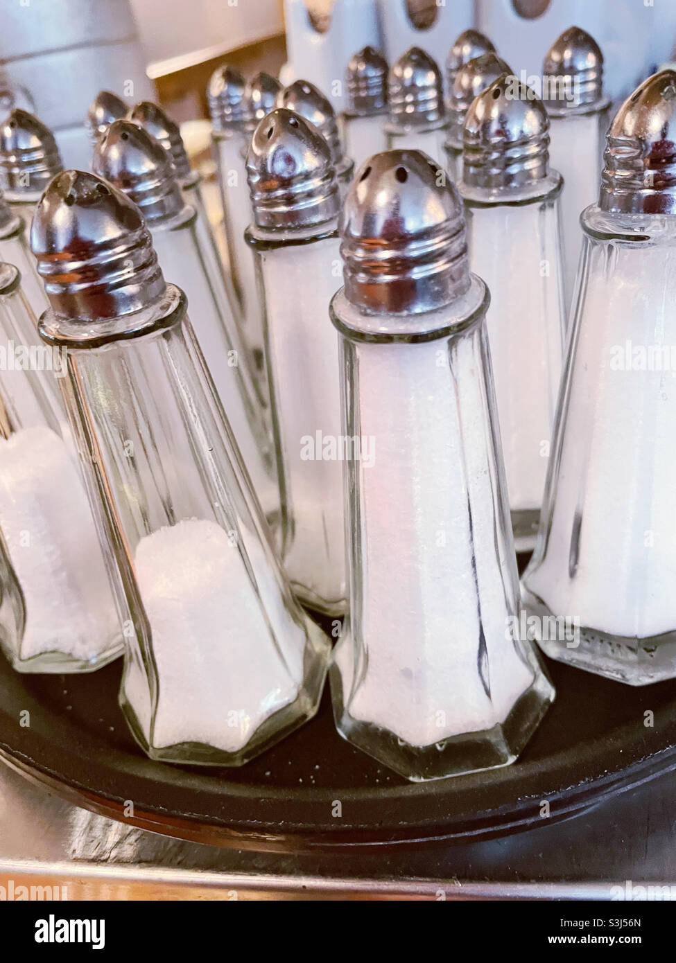 A tray full of salt shakers in a restaurant kitchen, USA Stock Photo ...